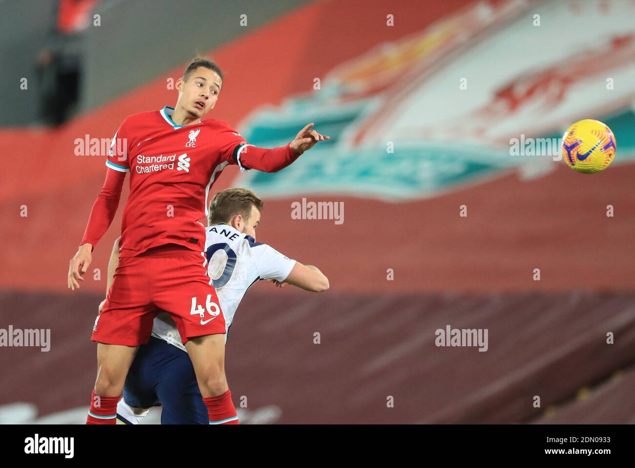 Rhys Williams #46 of Liverpool wins the high-ball from Harry Kane #10 ...