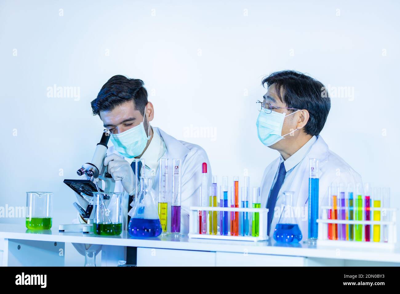 Team of research scientists analysing test trial new generation vaccine ...