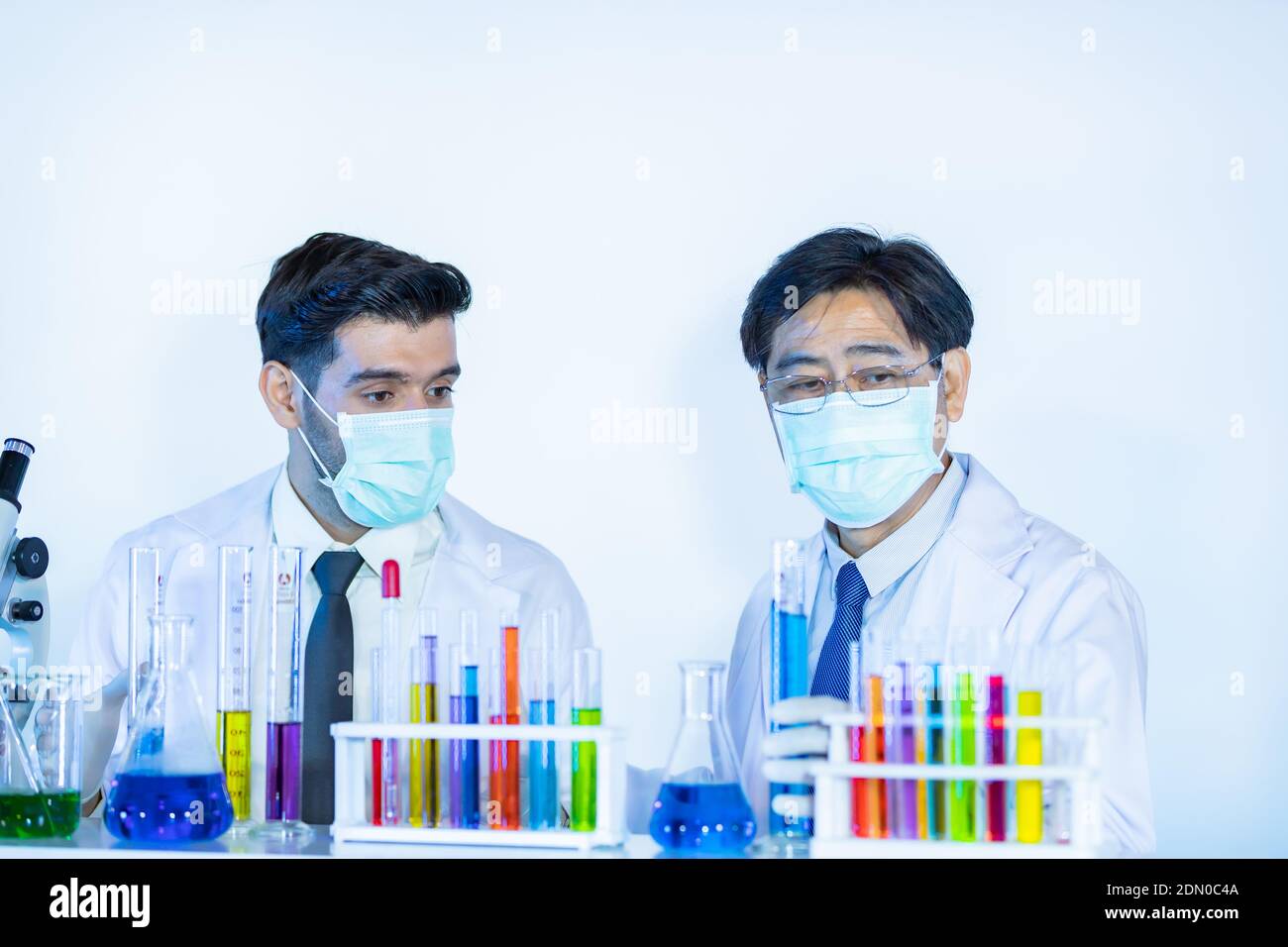 Team of research scientists analysing test trial new generation vaccine ...