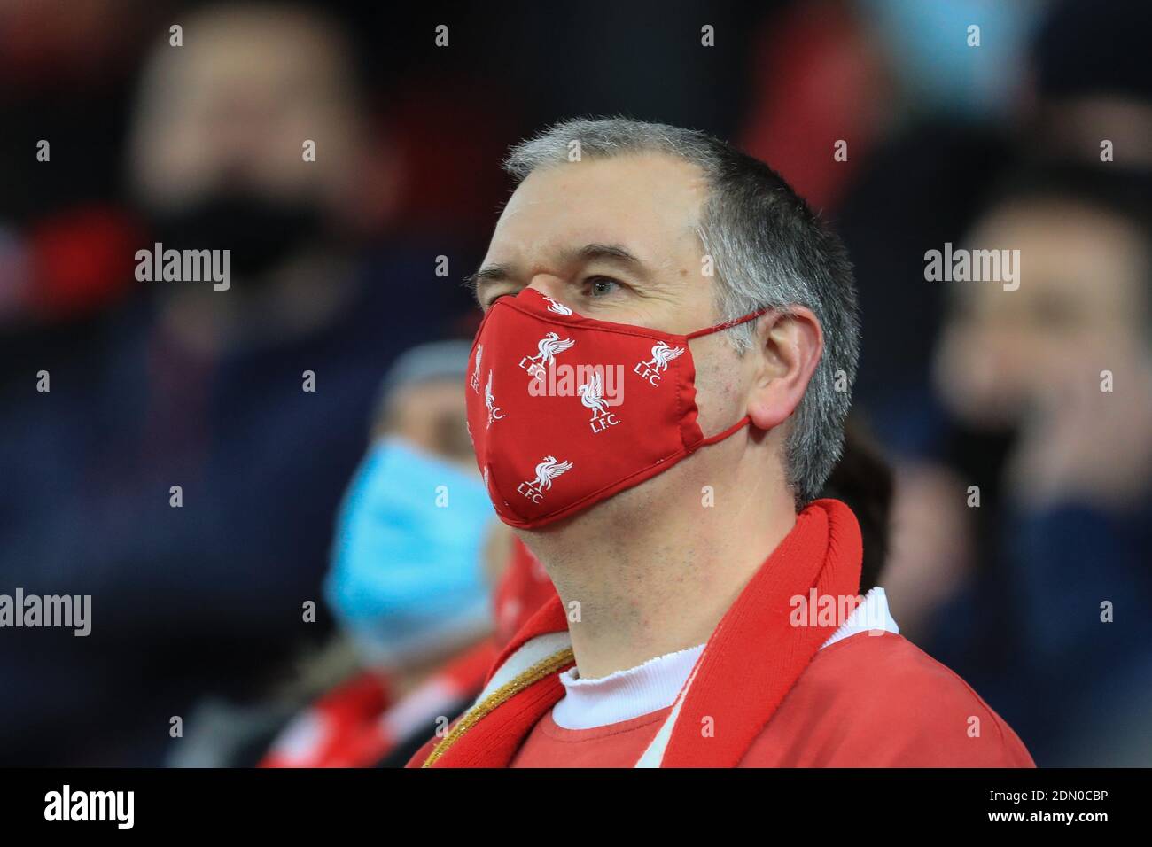 A Liverpool fan with a LFC face mask Stock Photo - Alamy