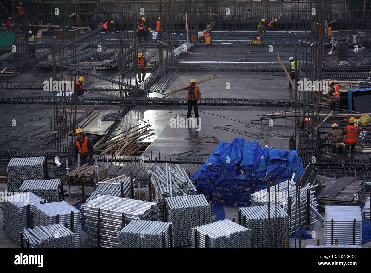 Beijing, China. 17th Dec, 2020. Workers operate at the construction ...