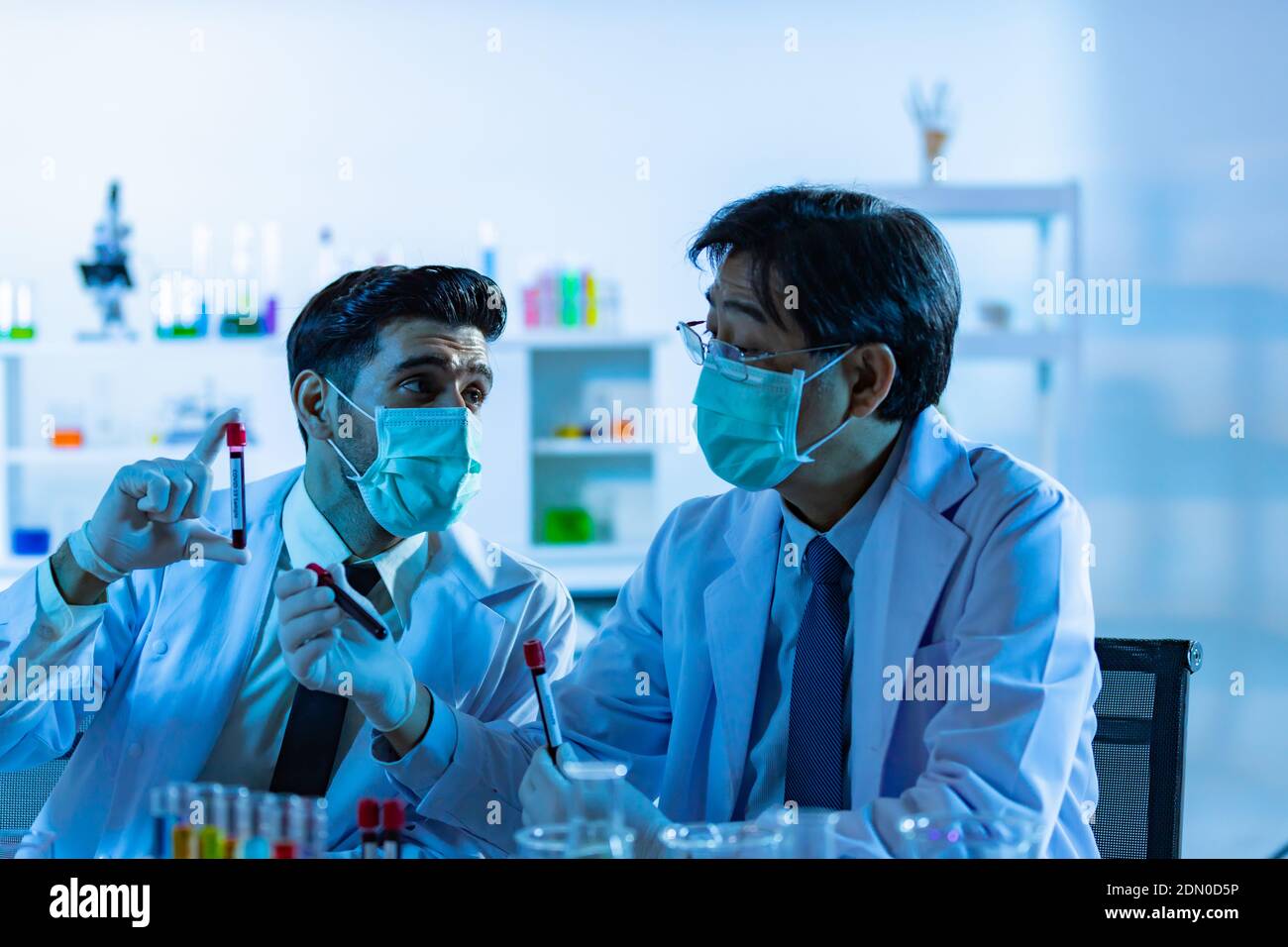 Team of research scientists analysing test trial new generation vaccine ...