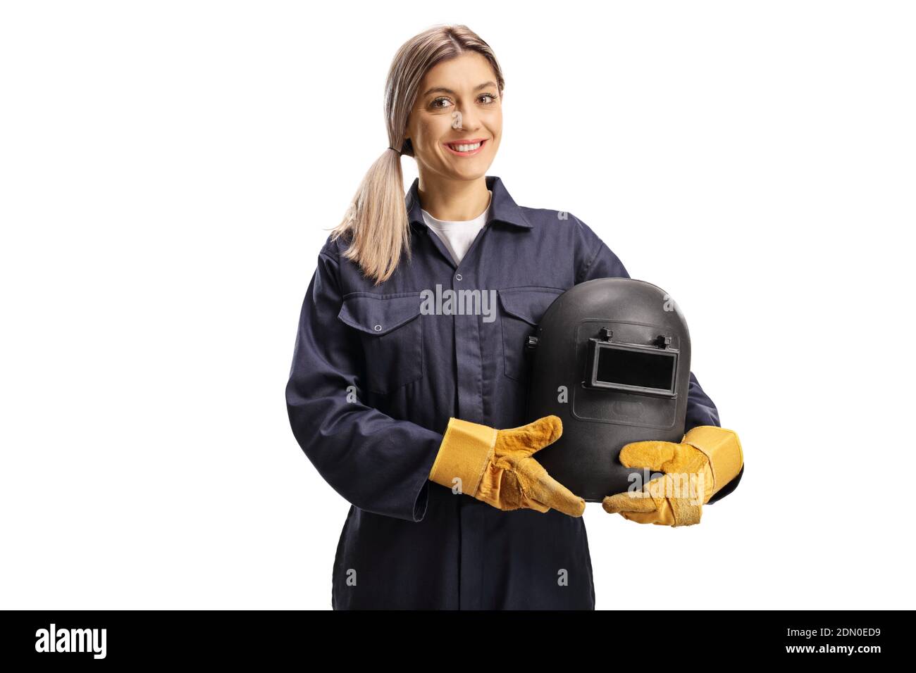 Female welder in a uniform holding a protective helmet isolated on ...