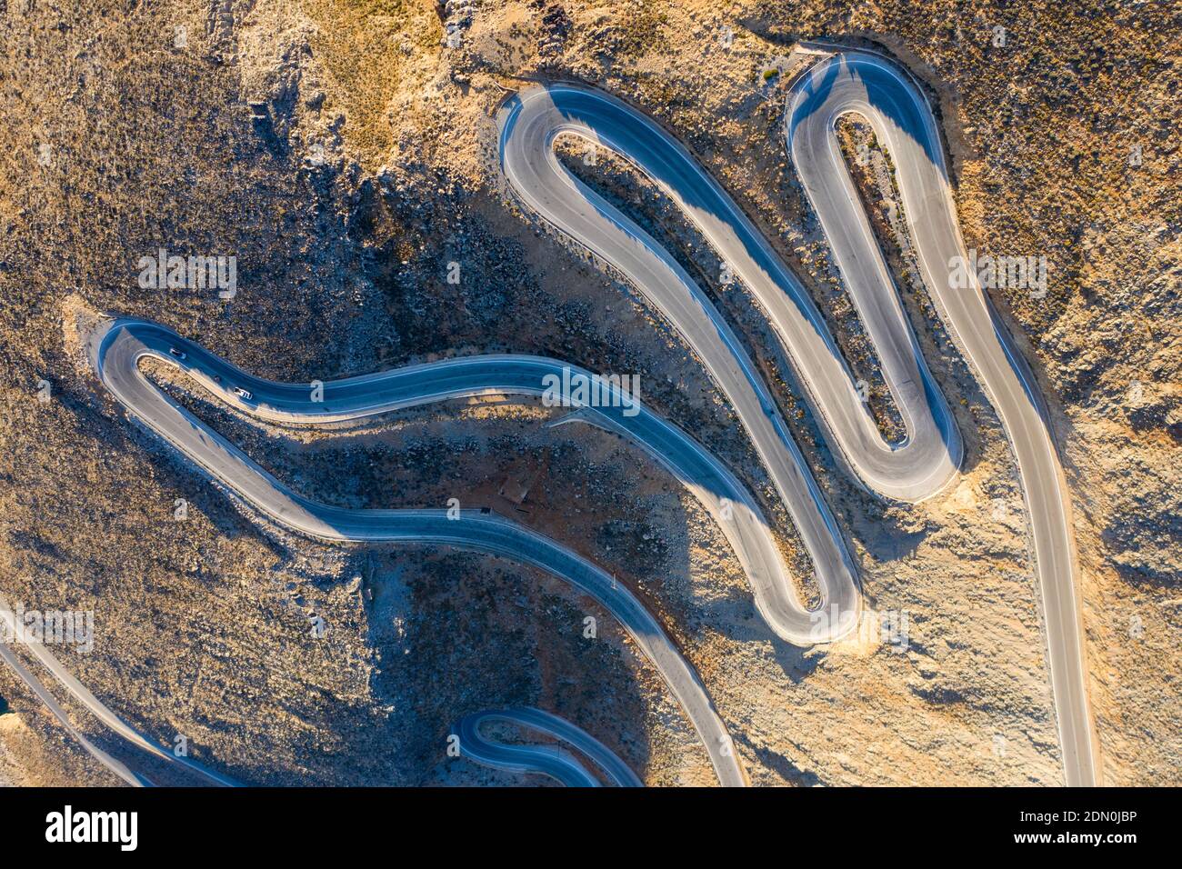 Top-down aerial view of the winding road between the towns of Hora ...