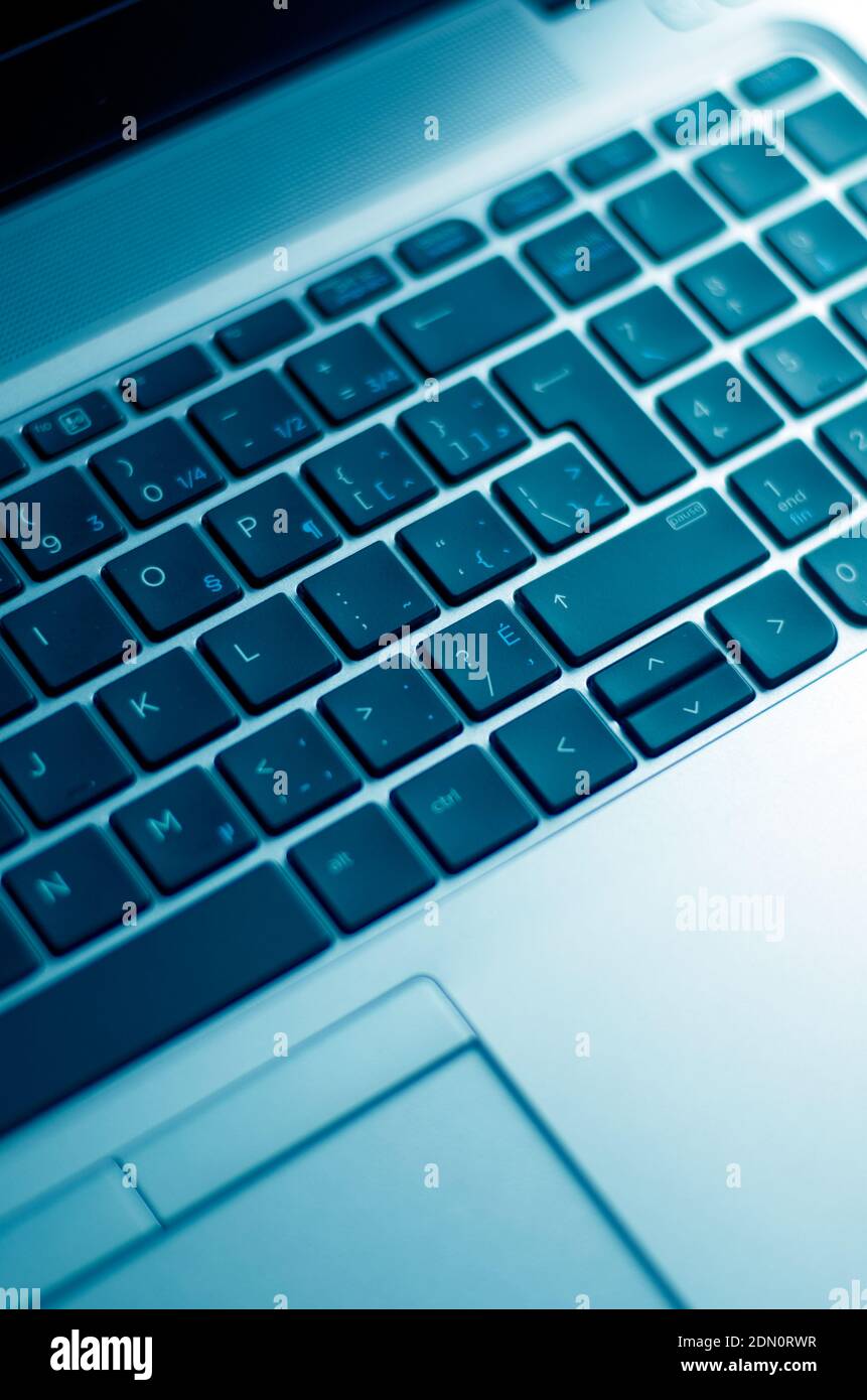 Diagonal View of Blue Toned Laptop Keyboard Vertical Stock Photo - Alamy