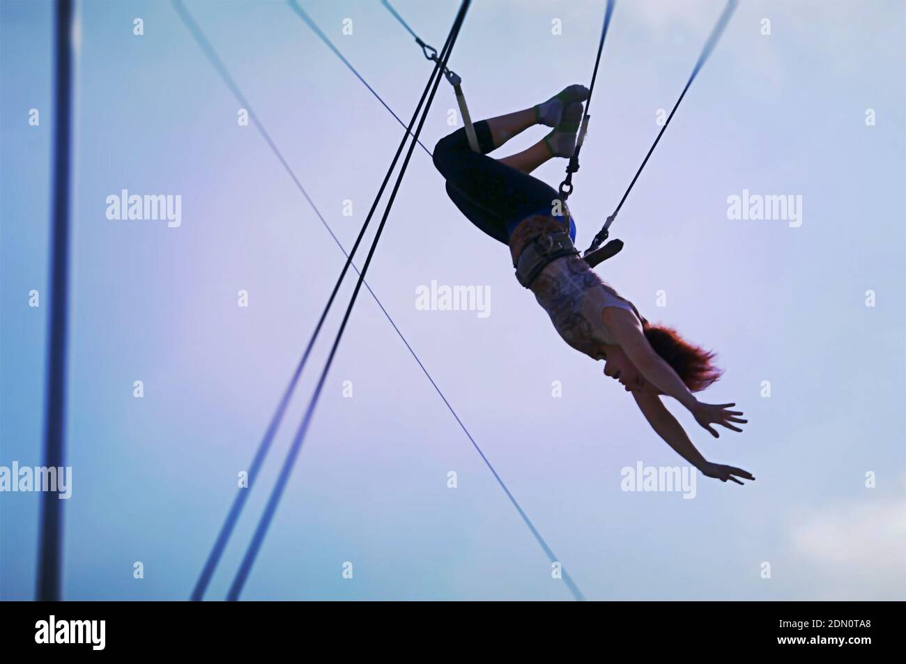 Trapeze artist hanging upside down hi-res stock photography and images ...