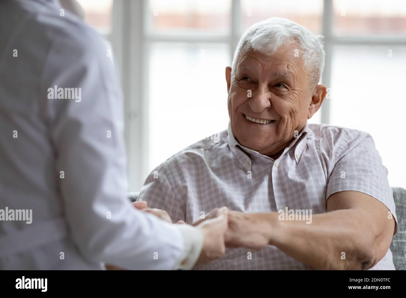Doctor support encourage retired older man patient holding his palms ...