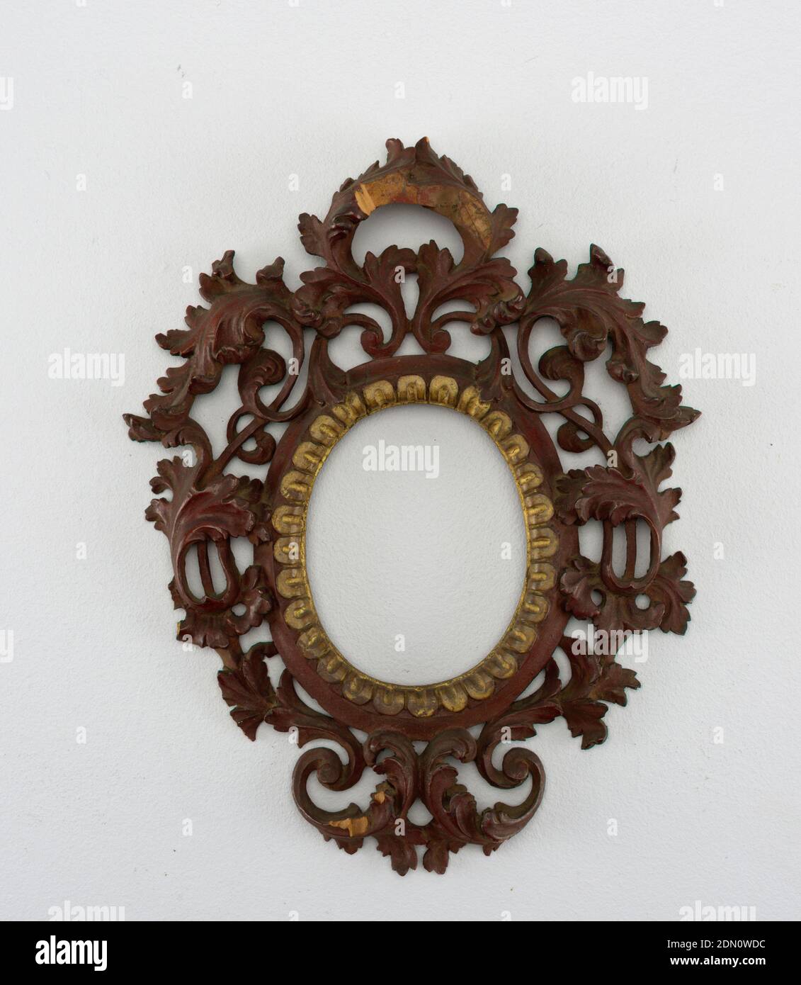 Central vertically ovoidal moulded frame surrounded hi-res stock ...