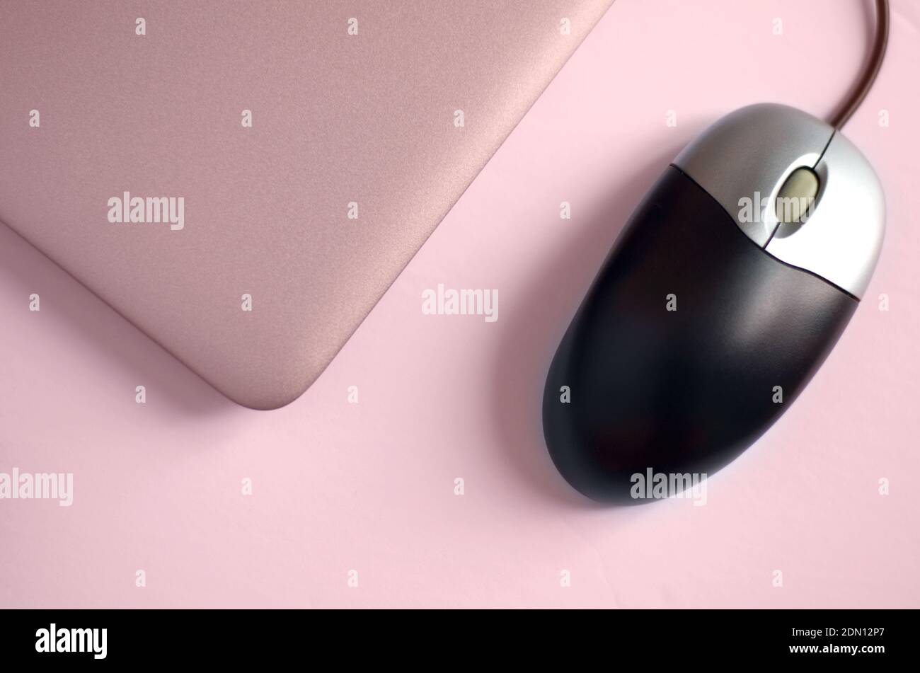 Diagonal View of Pink Toned Laptop and Mouse on White Background ...