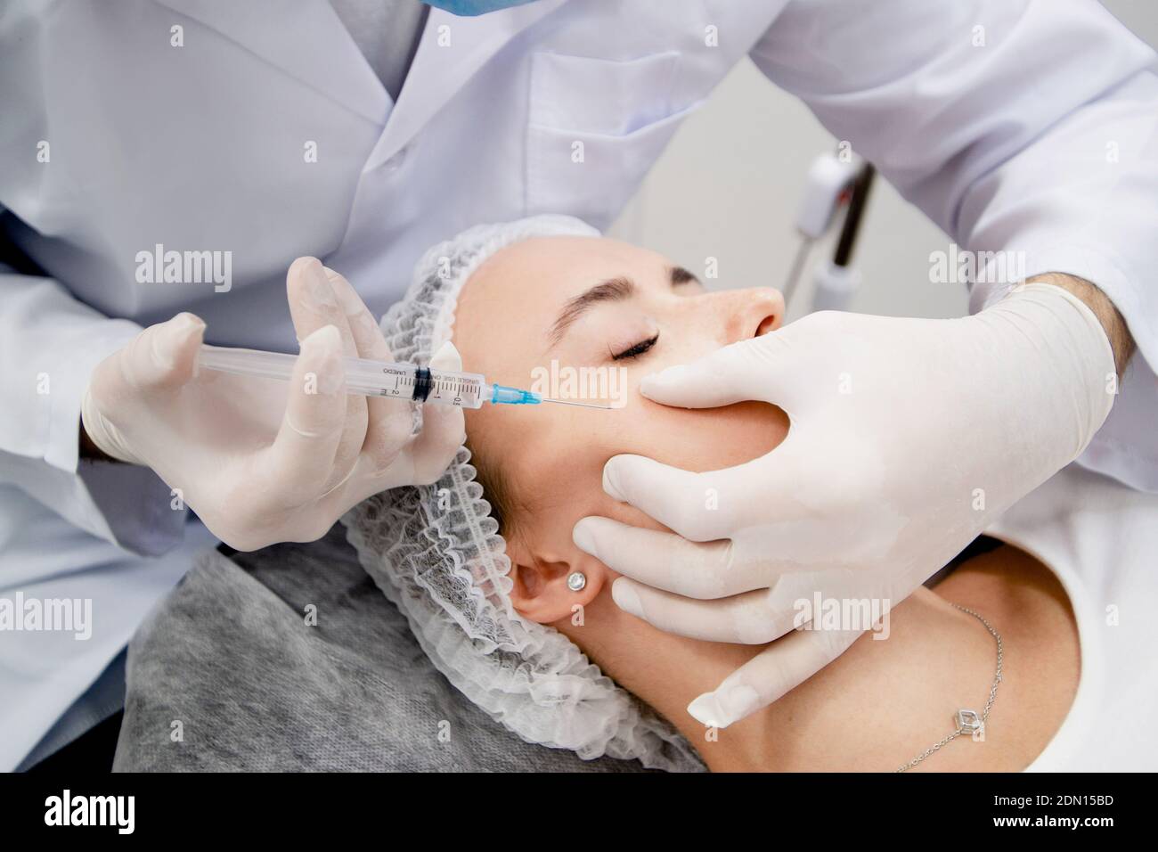 Young woman's getting injections to solve some age-related skin ...