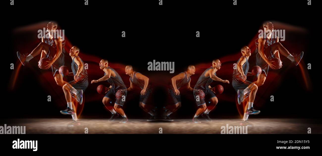 Young purposeful basketball player training in action on black ...