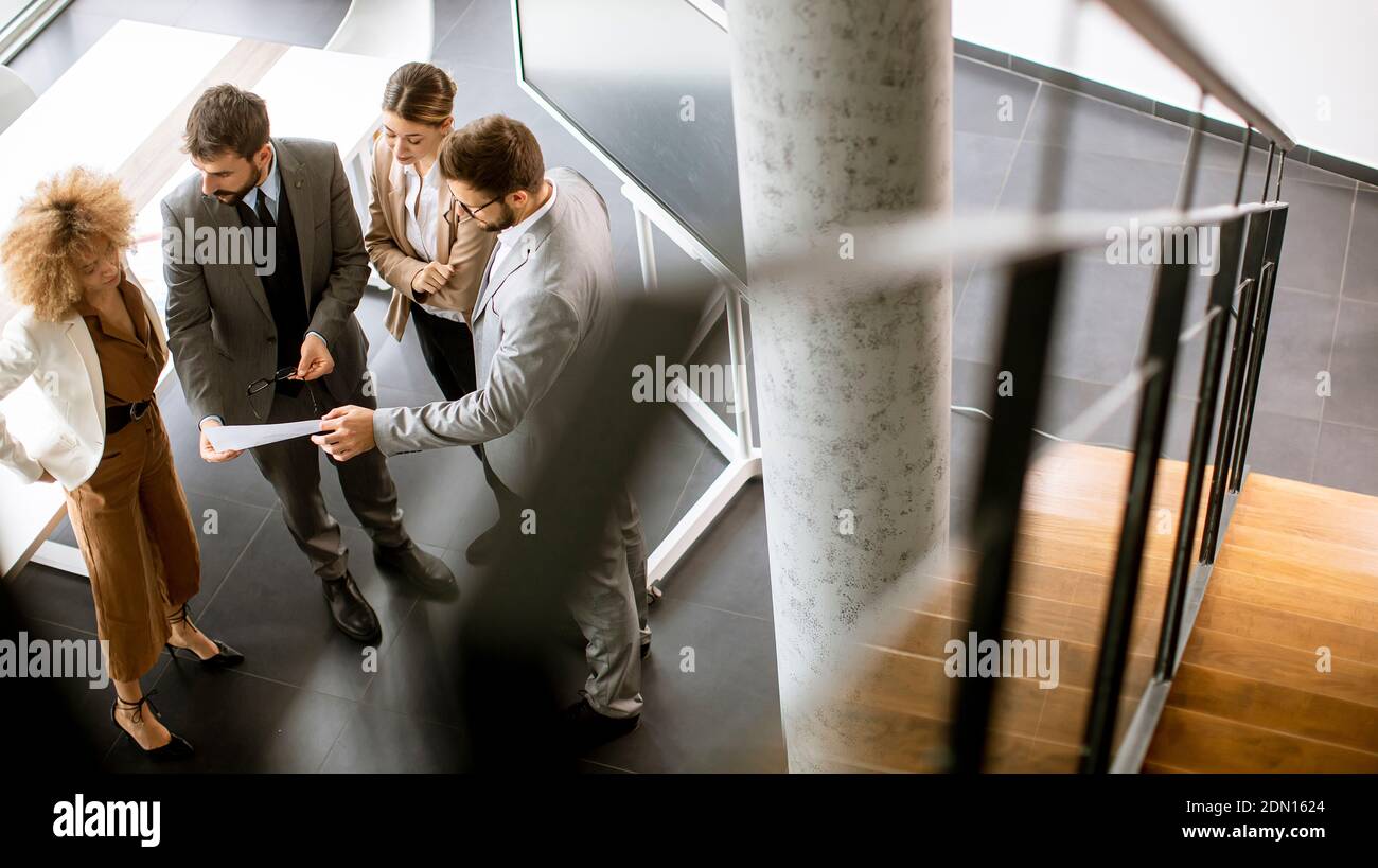 Overhead view at group of multiethnic business people working together ...
