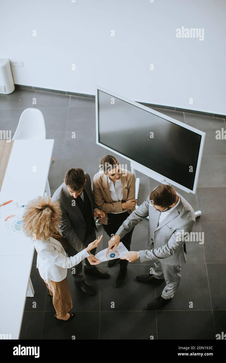 Overhead view at group of multiethnic business people working together ...