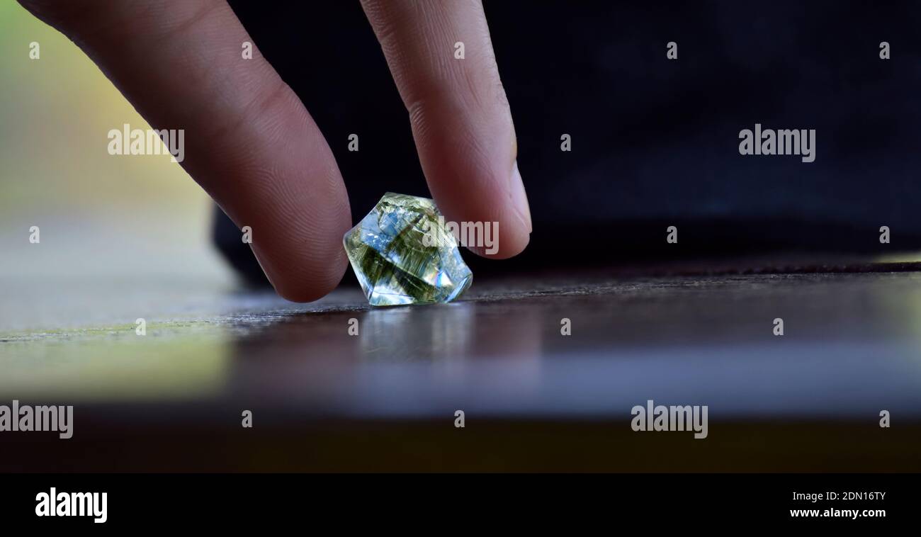 Hand holding glass diamonds hi-res stock photography and images - Alamy