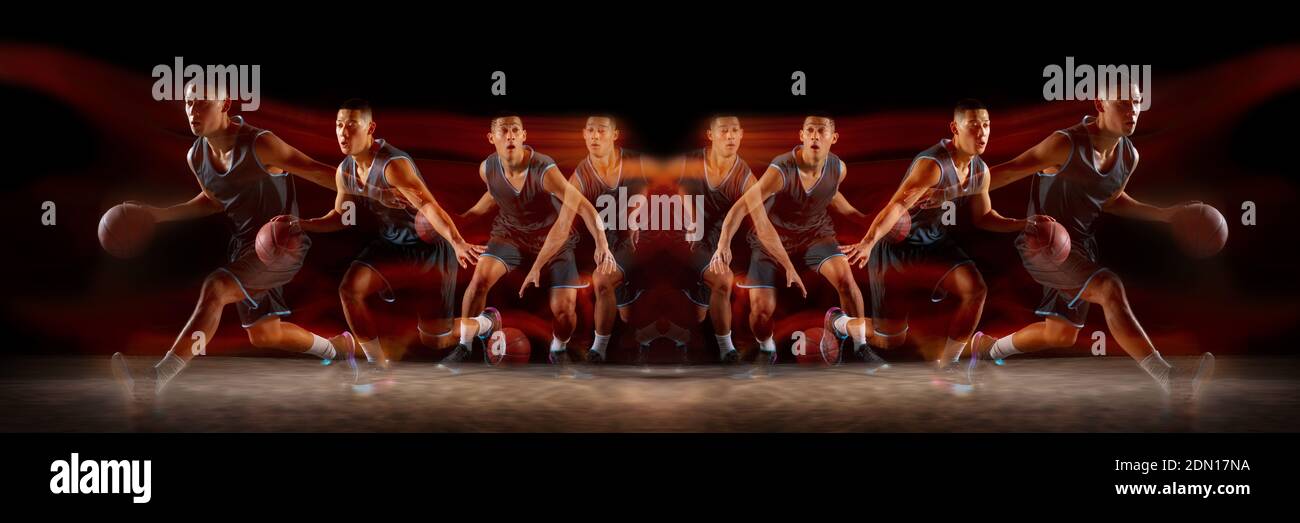 Young purposeful basketball player training in action on black ...