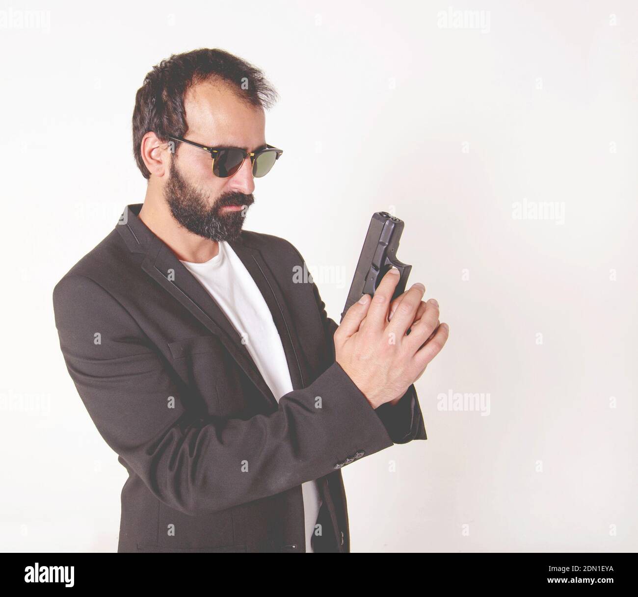 Hoding gun hi-res stock photography and images - Alamy