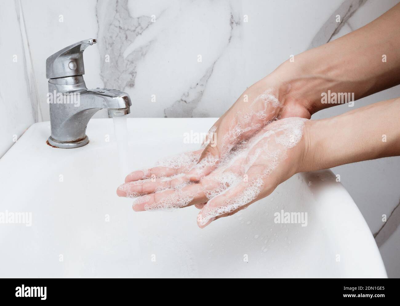 Women hand washing in stream hi-res stock photography and images - Alamy