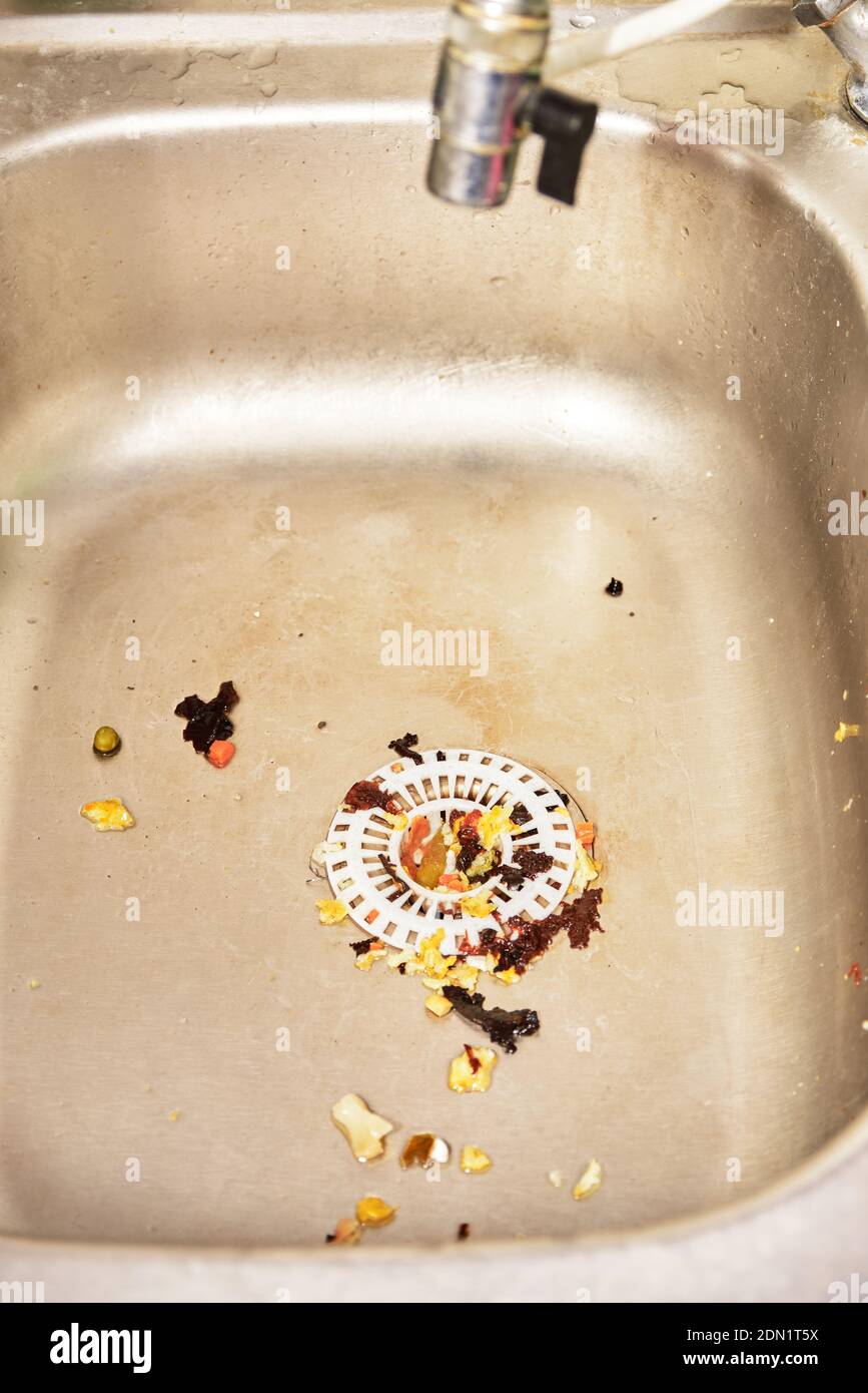 dirty sink with food leftovers. blockage sink with tap Stock Photo - Alamy