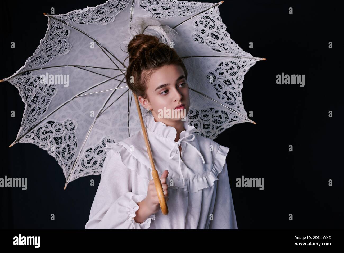 vintage portrait of teenage girl in retro dress with white umbrella ...