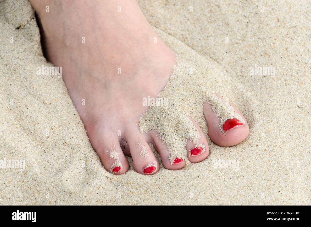 Painted red toenails hi-res stock photography and images - Alamy