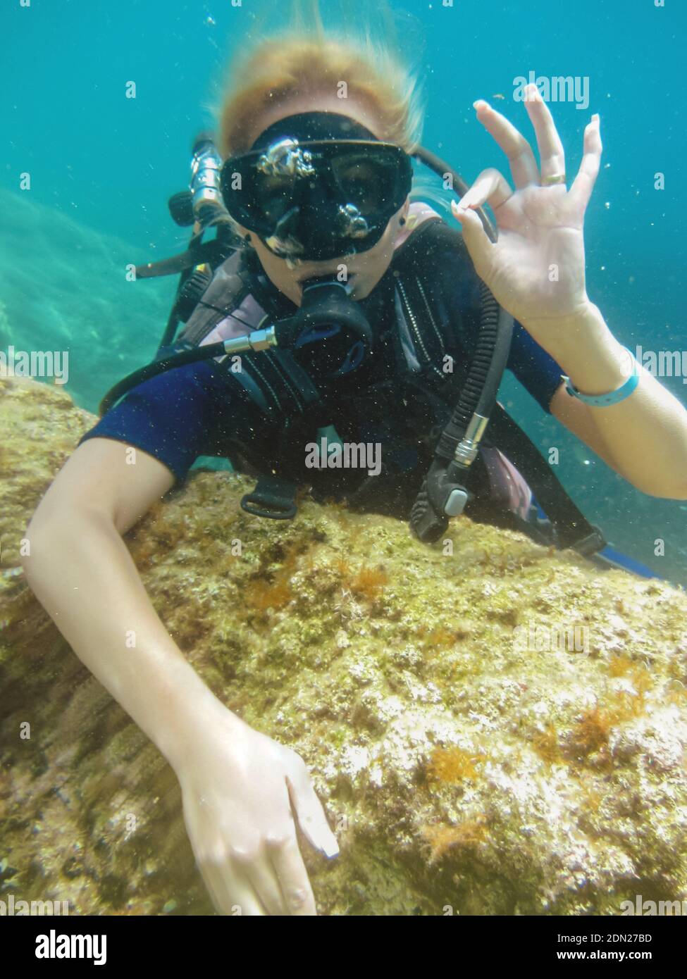 Diver swimming in sea ok hi-res stock photography and images - Alamy