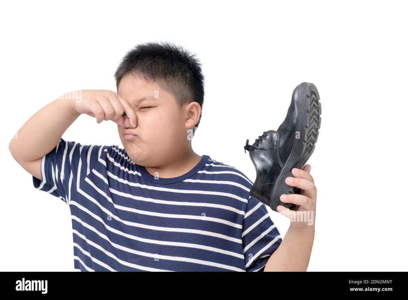 Boy Covering Nose While Holding Shoe Against White Background Stock ...