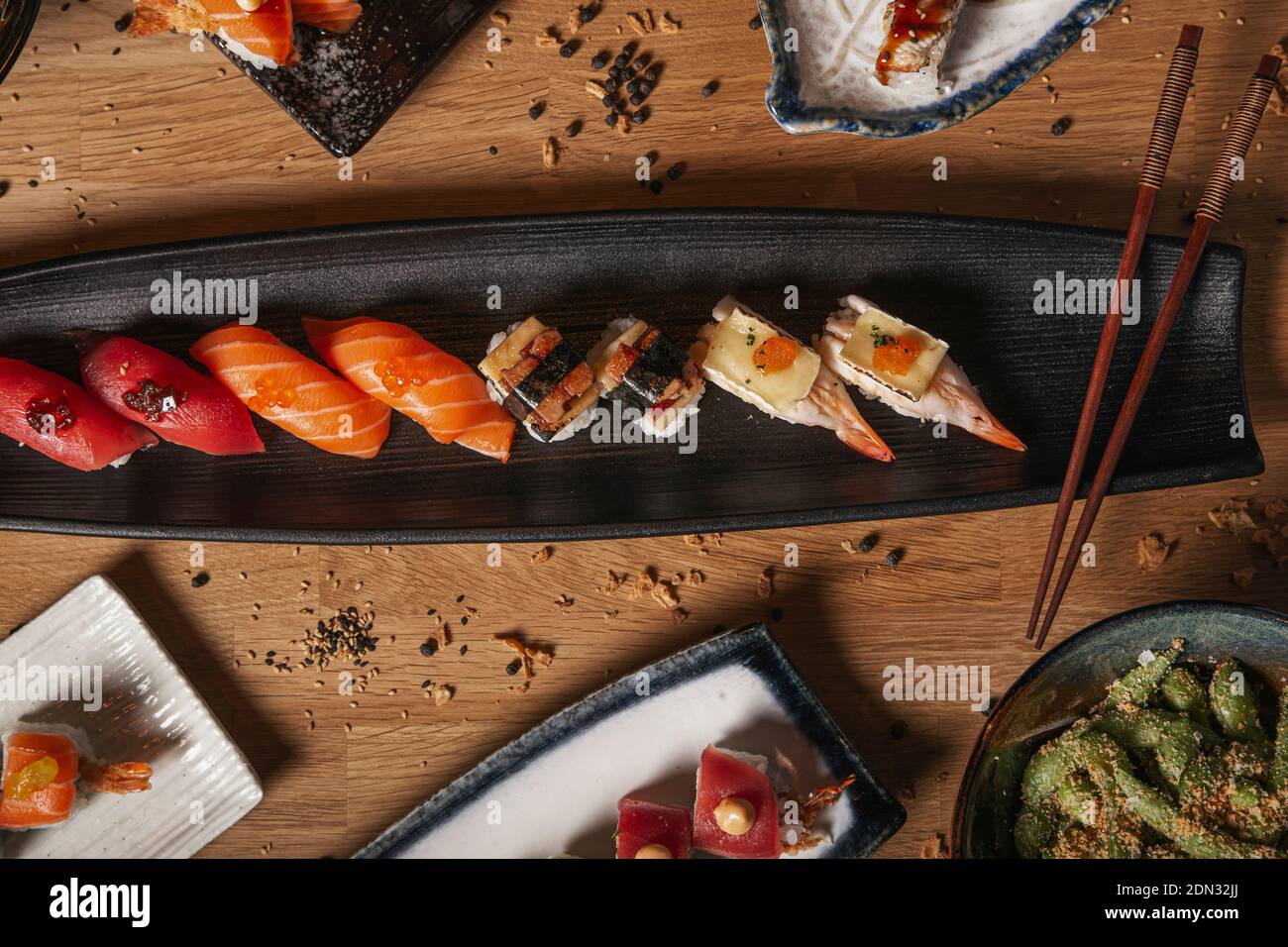 On the restaurant table a variety of nigiris. Japanese food Stock Photo ...