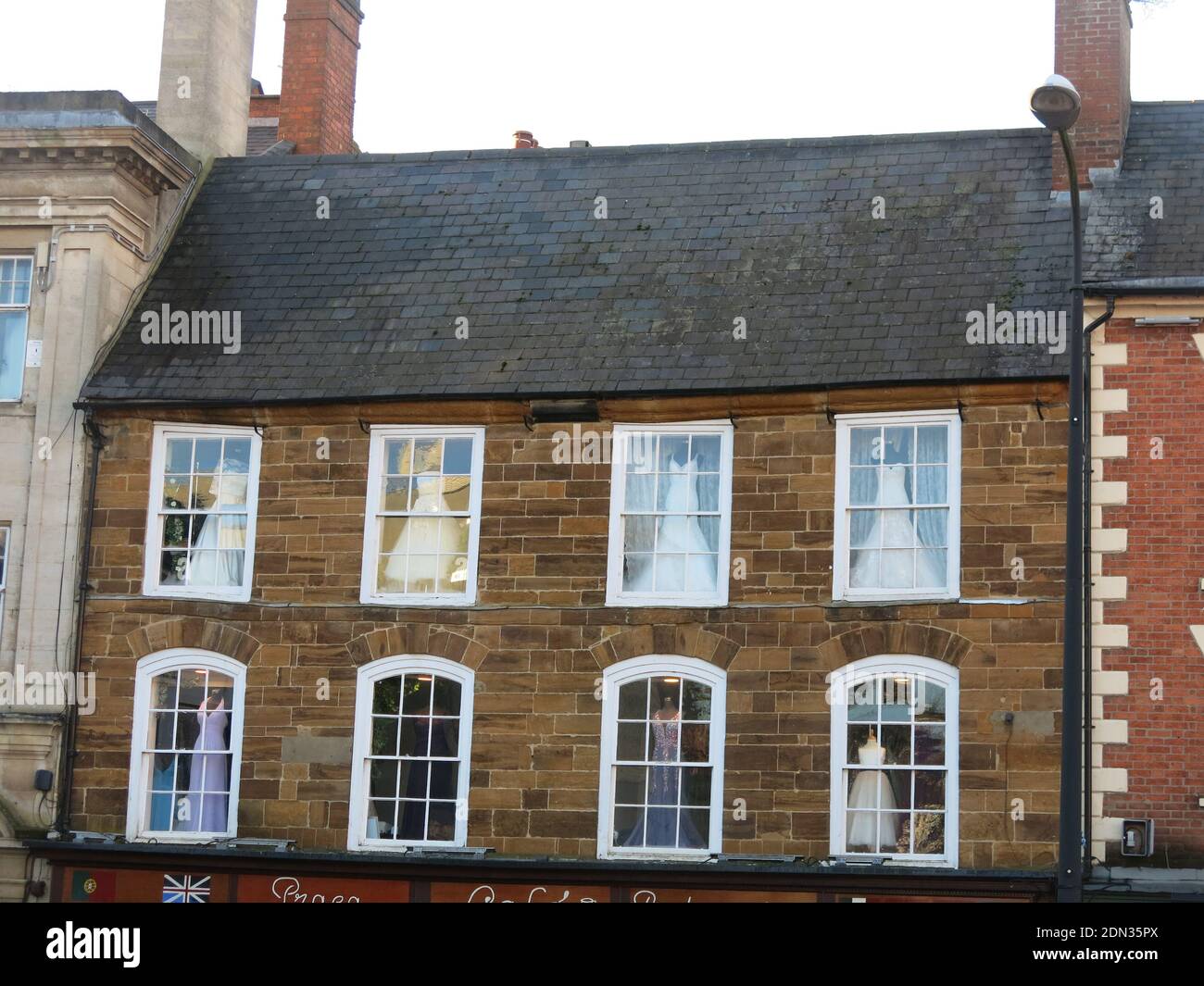 Two rows of windows with wedding dresses on display: the facade of a ...