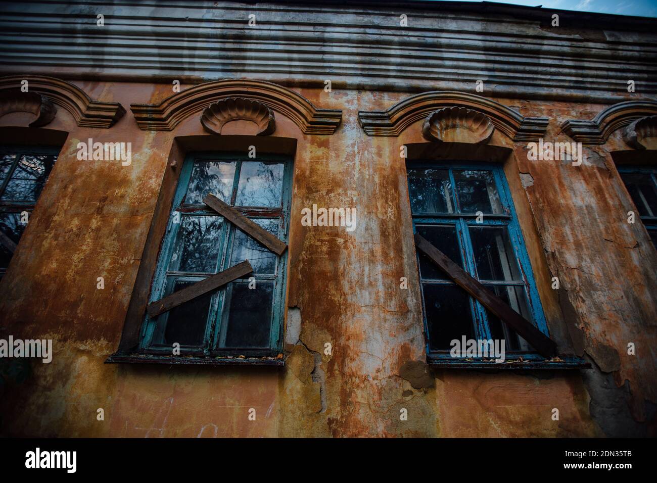 Old boarded up windows of abandoned building Stock Photo - Alamy