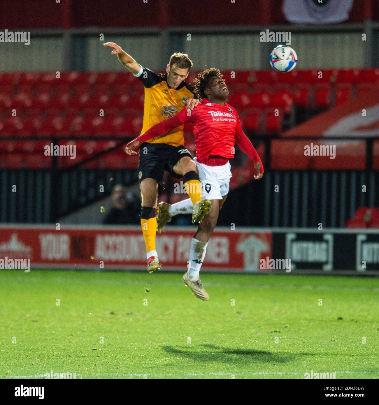 Mickey Demetriou of Newport County in an aerial challenge with Brandon ...