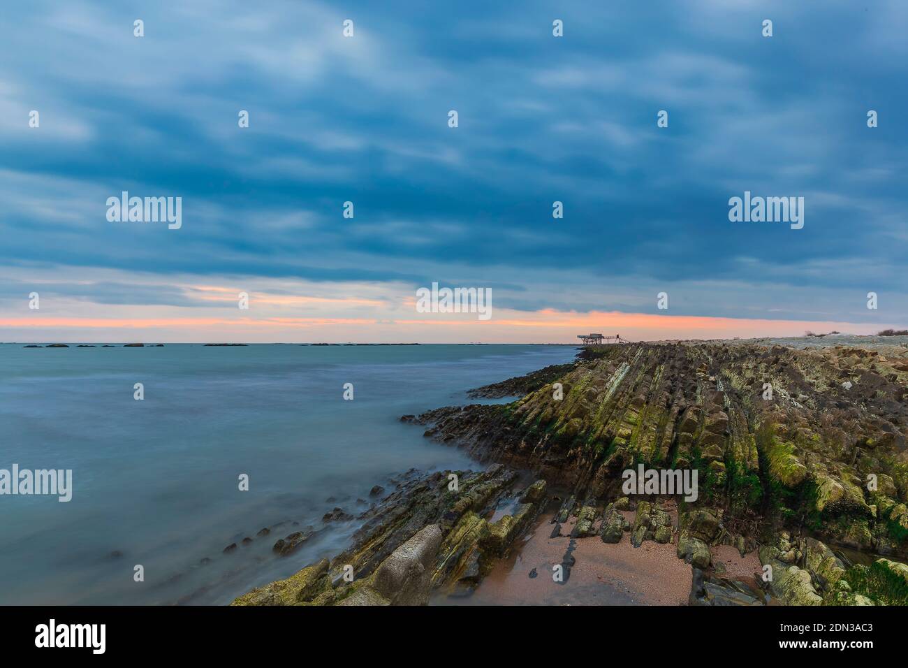 Vertical rock formation on the sea coast Stock Photo - Alamy
