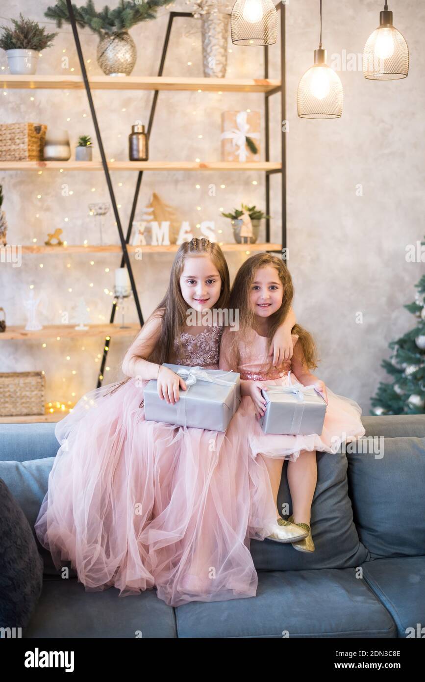Two Happy little sisters looking like little princesses in their ...