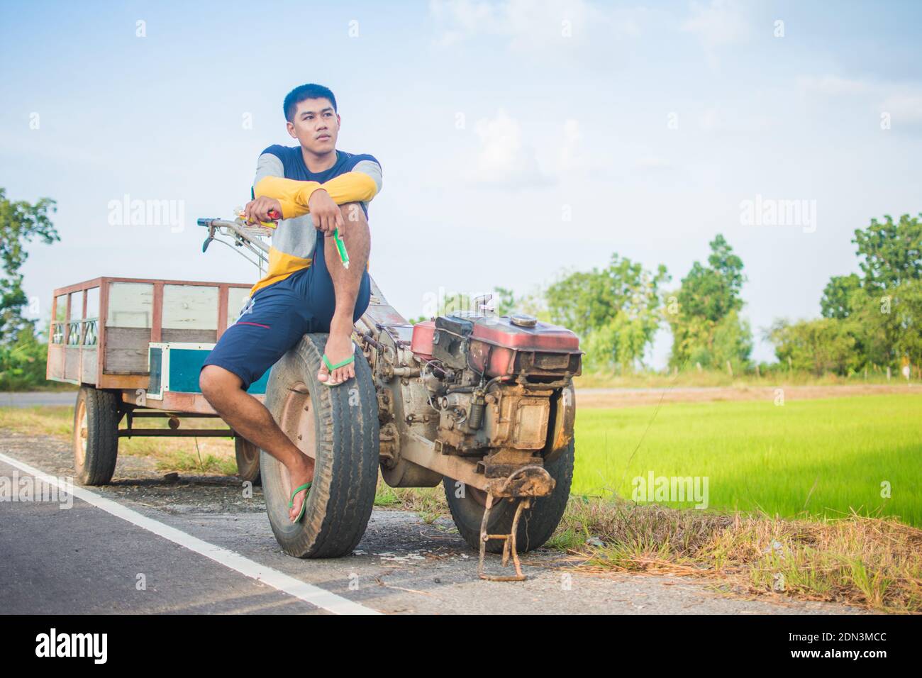 Young man sitting on tractor hi-res stock photography and images - Alamy