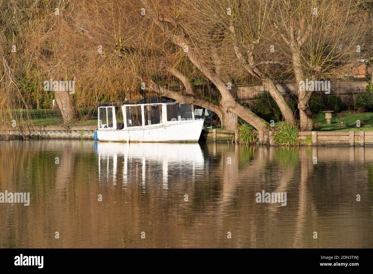 View of boat moored on the bank of the River Thames at Cookham ...