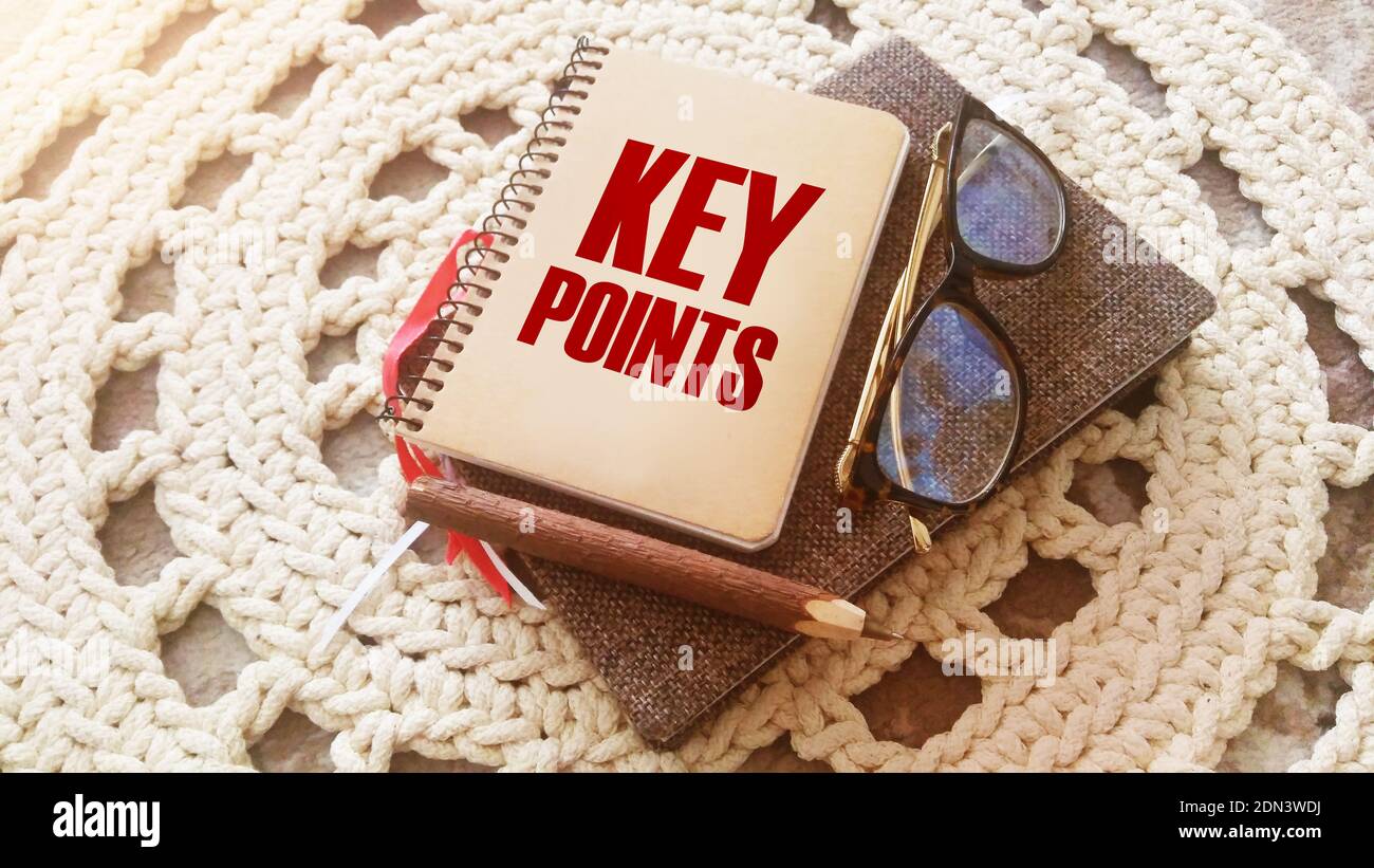 text KEY POINTs on the cover of a book, eye glasses and pen. Business ...