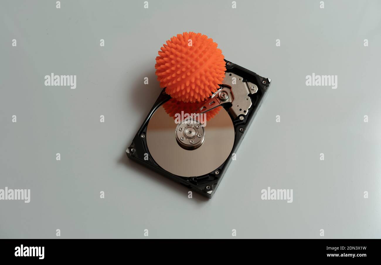 Concept, data infected by a virus. Disassembled hard drive with virus ...