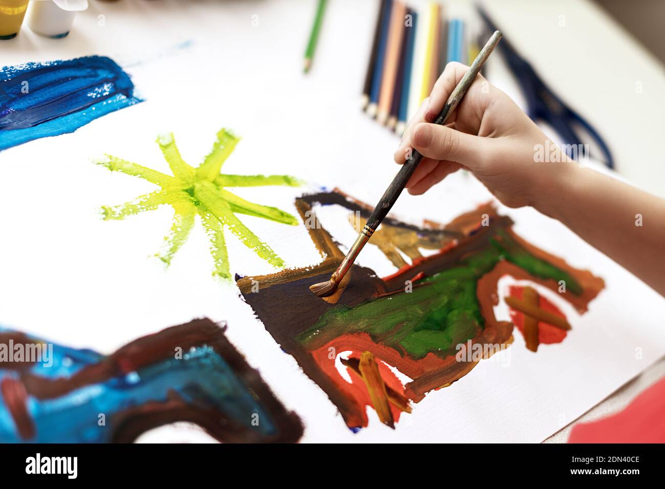 selective focus photo of a little boy's hand, with a paintbrush ...