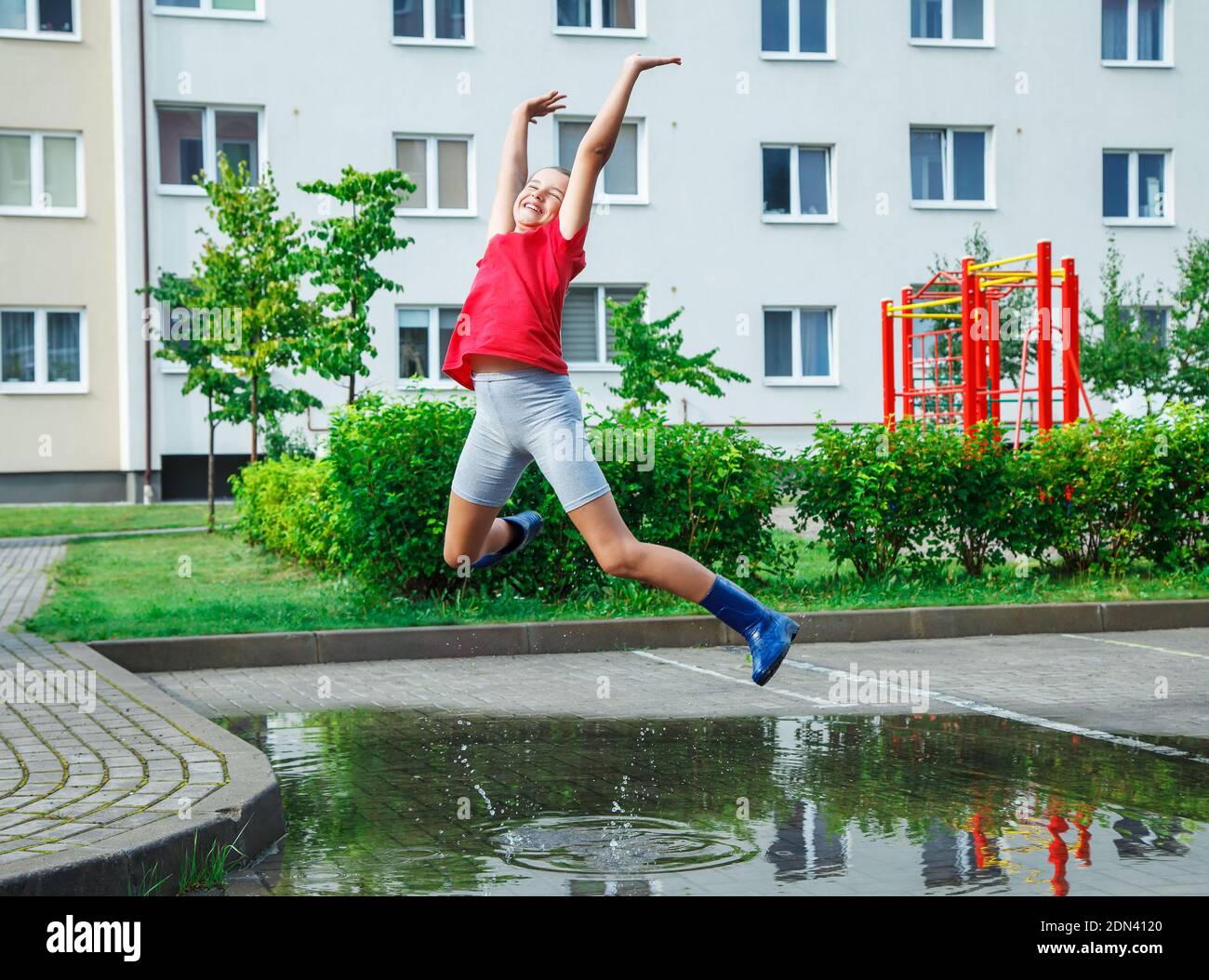 Jumping over puddle hi-res stock photography and images - Alamy