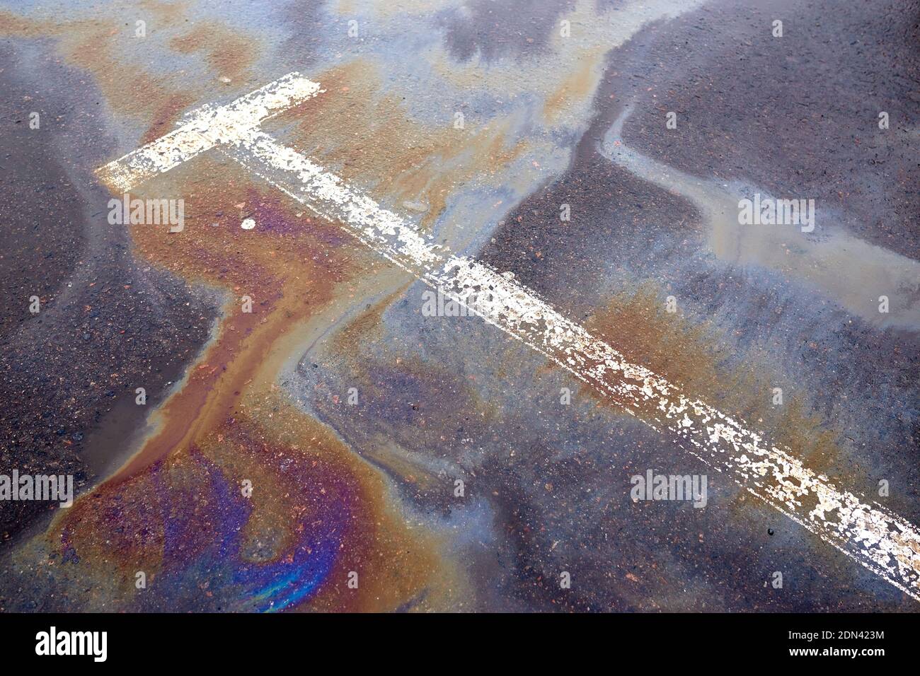 Colored oil stains in the car park, the color of the gasoline stain on ...