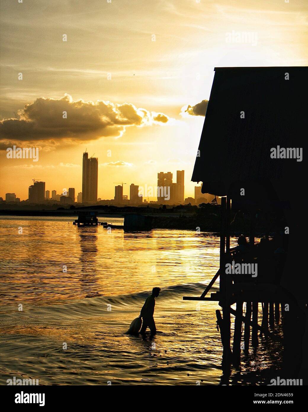 Person wading river buildings hi-res stock photography and images - Alamy