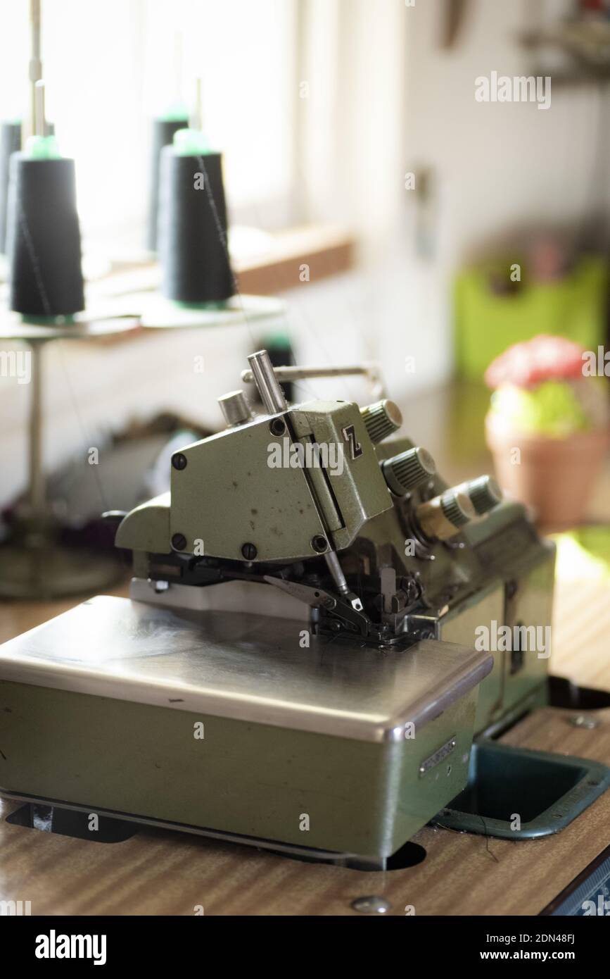 A vertical shot of an industrial overlock machine Stock Photo - Alamy