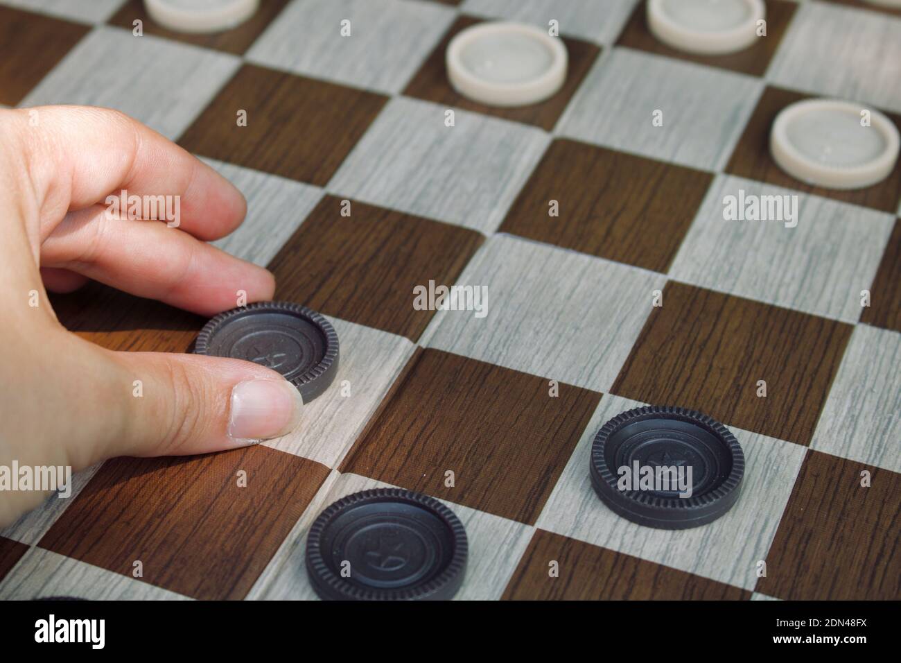 Person playing checkers hi-res stock photography and images - Alamy