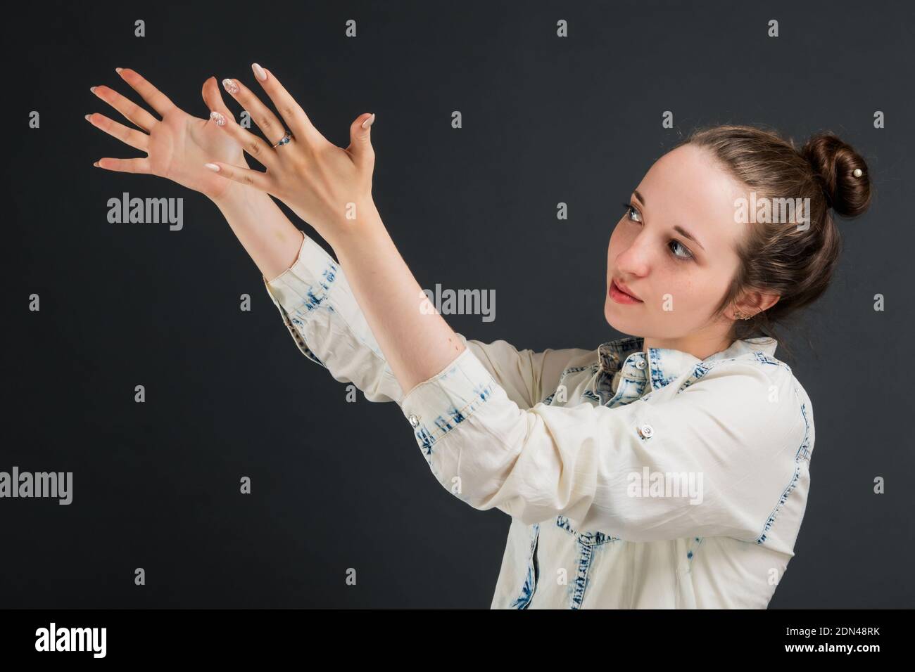 Very nice girl violently gesticulating with her hands Stock Photo - Alamy