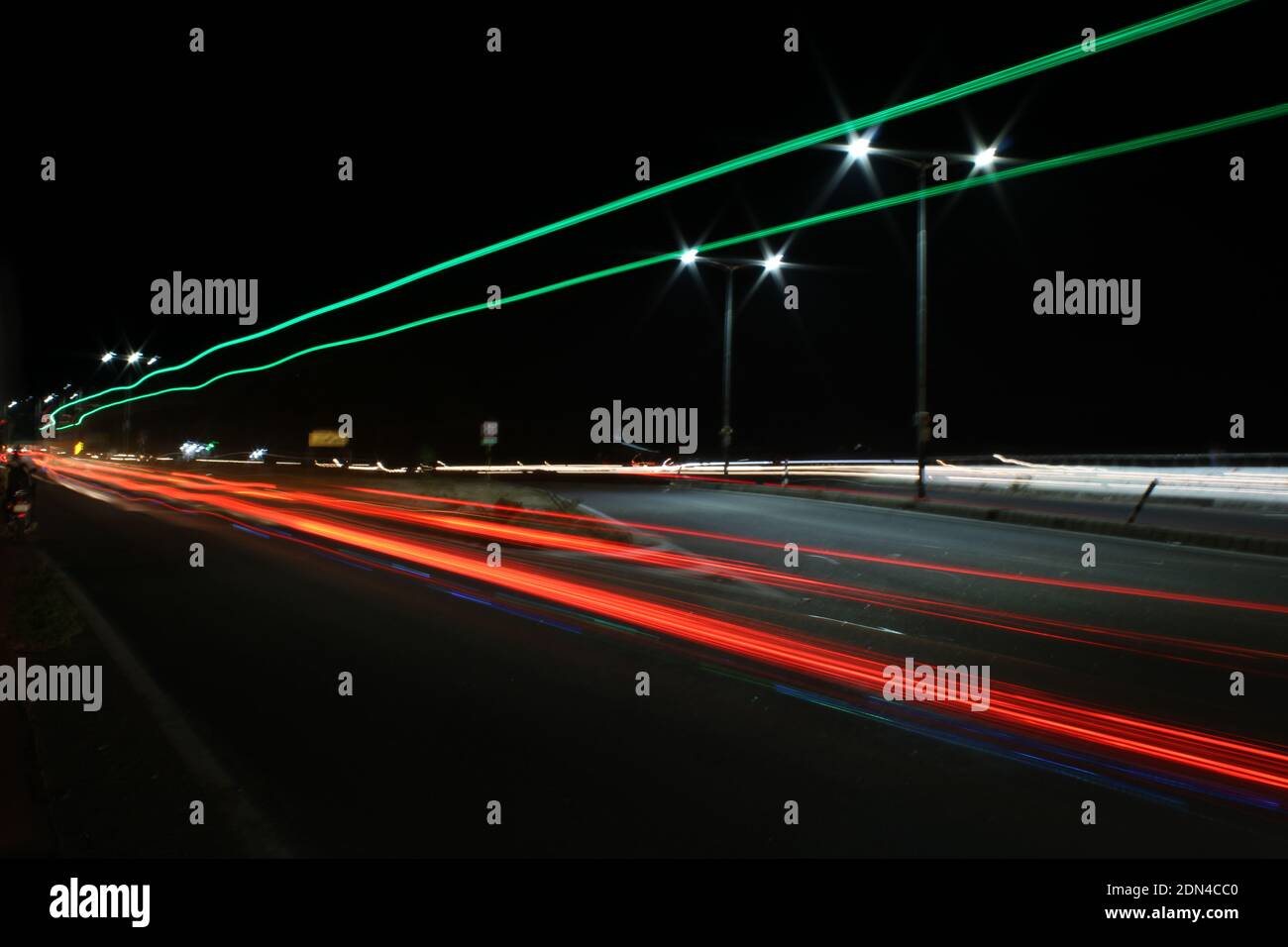 Light Trails On Road At Night Stock Photo - Alamy