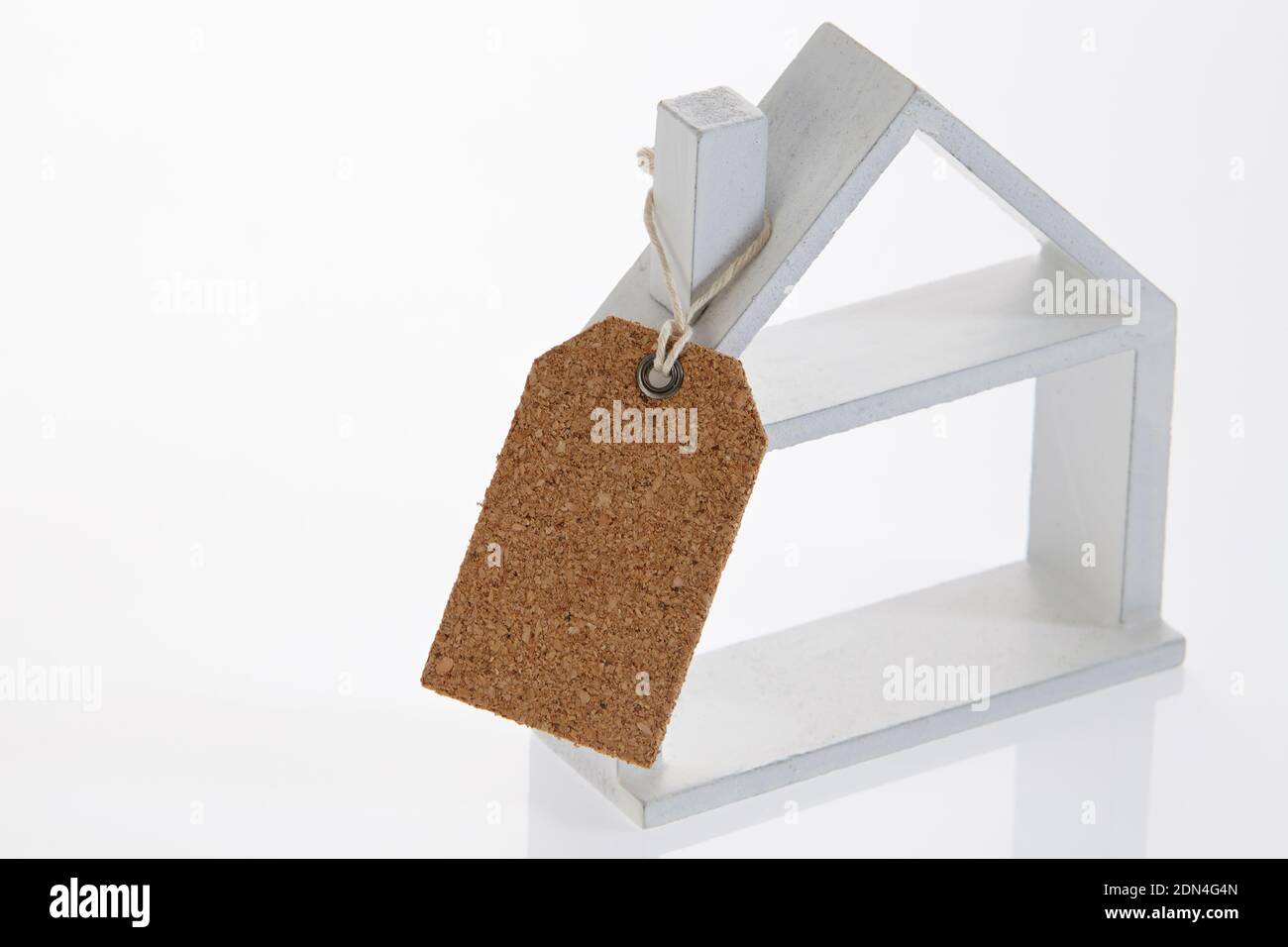 Close-up Of Price Tag On Model Home Over White Background Stock Photo ...