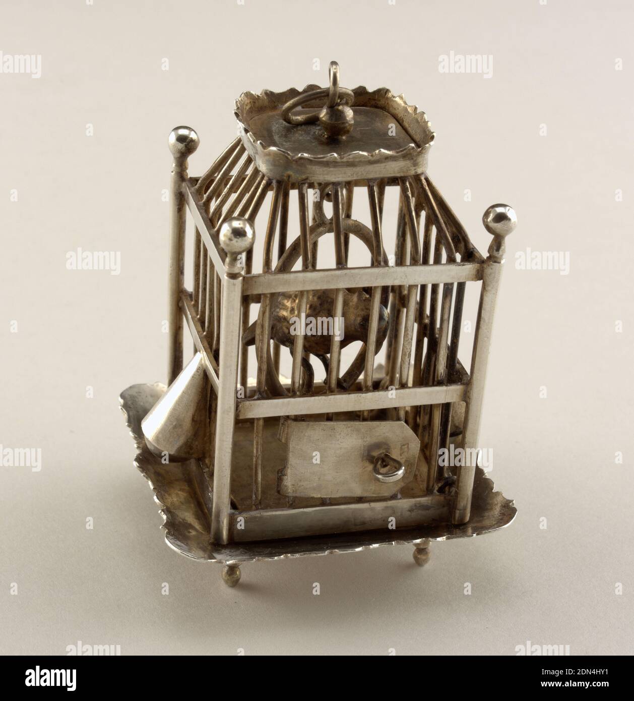 Four footed scrolled tray supports barred cage hi-res stock photography ...