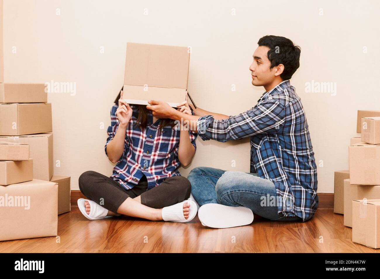 Cross legged man holding container hi-res stock photography and images ...