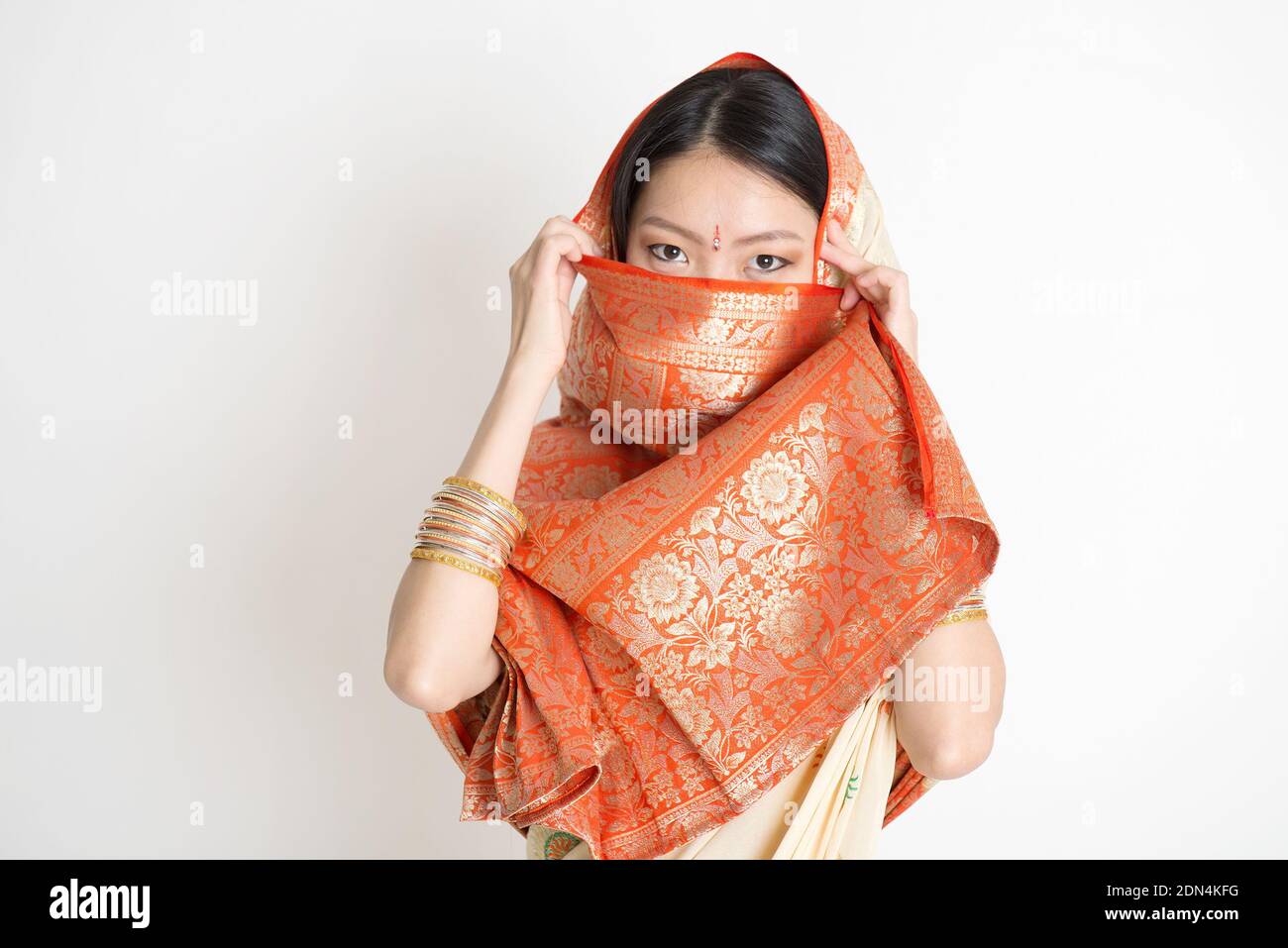 Indian woman covering face sari hi-res stock photography and images - Alamy