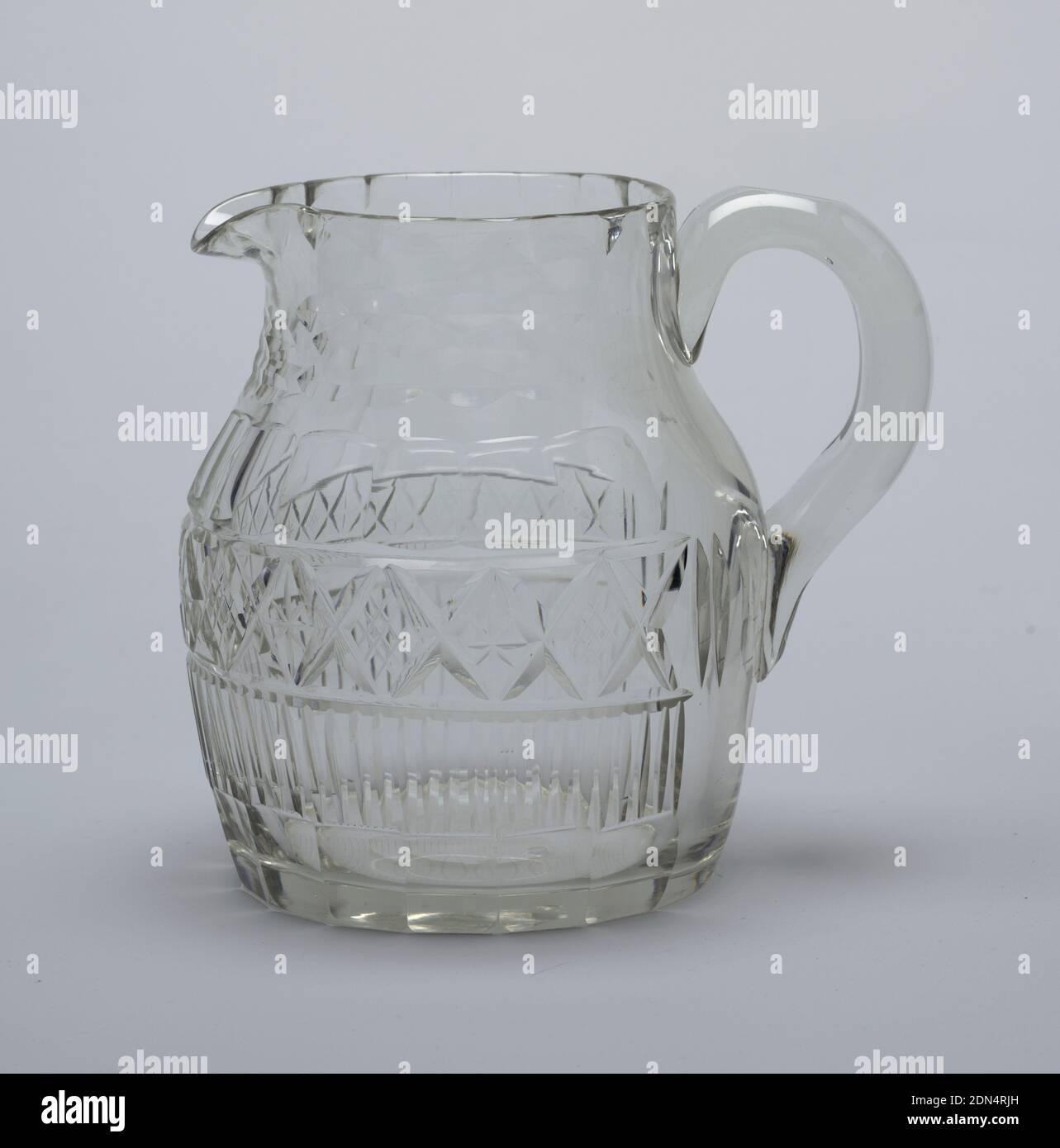 Jug, Glass, Circular body, flat base, tapered neck, small pouring spout ...