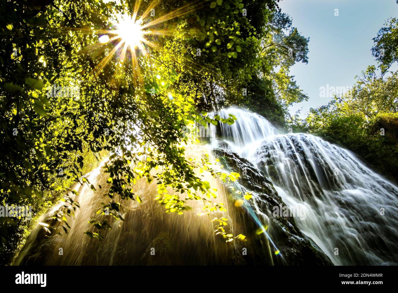 Sun shining through falling water hi-res stock photography and images ...